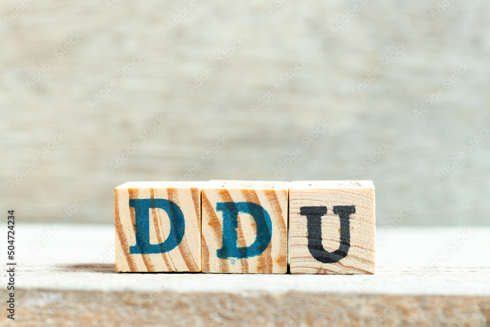 Alphabet letter block in word DDU (abbreviation of Delivered Duty ...