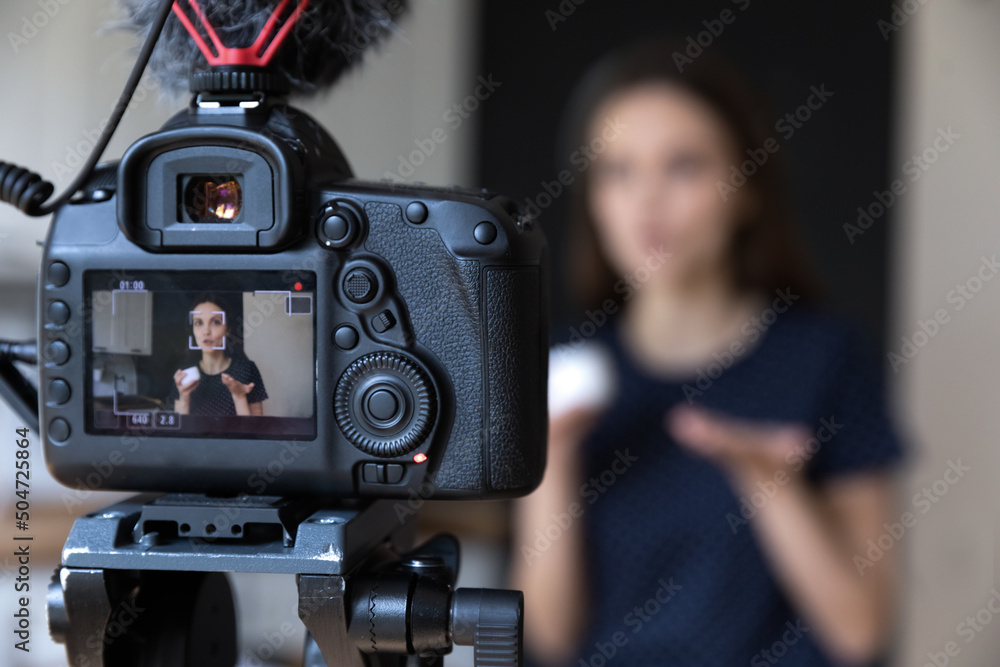 Young beauty blogger girl recording video on dslr camera, shooting post ...