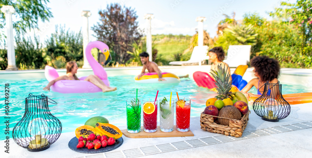 summer swimming pool party! happy multiracial group of friends relaxing ...
