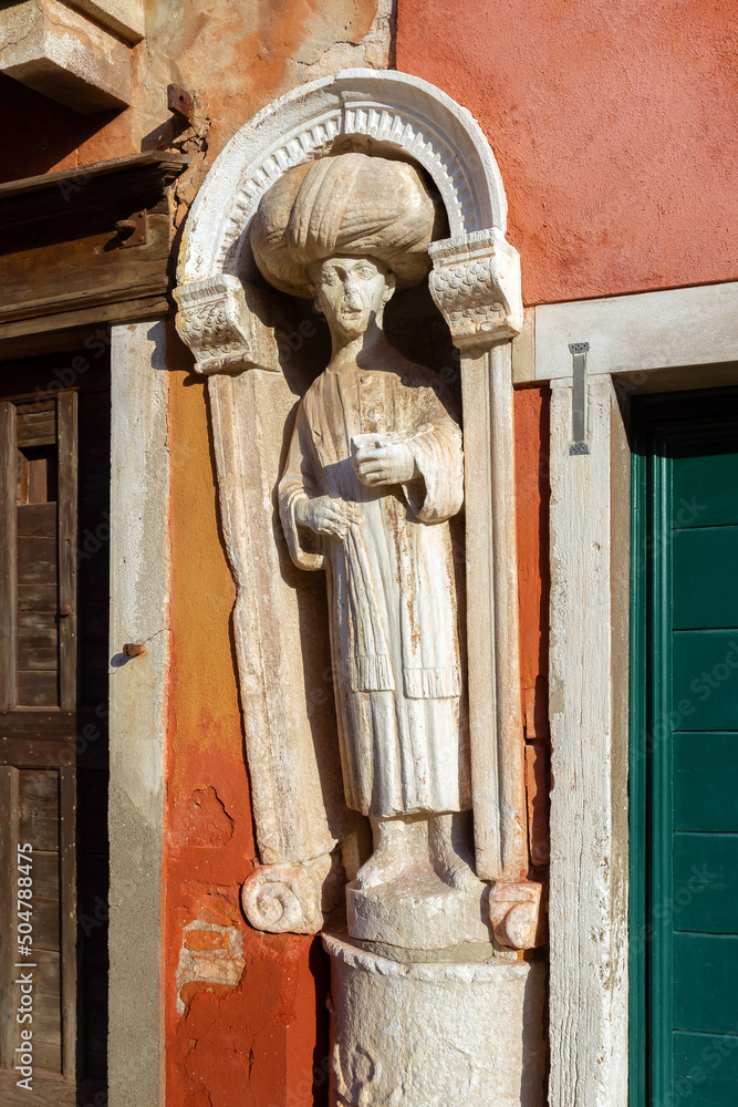 Photo & Art Print Statue of an arab at the entrance to the historic ...