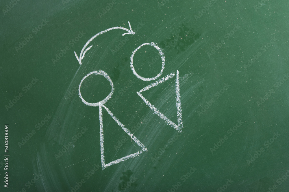 geometric silhouettes of a man and a woman drawn in chalk, gender ...