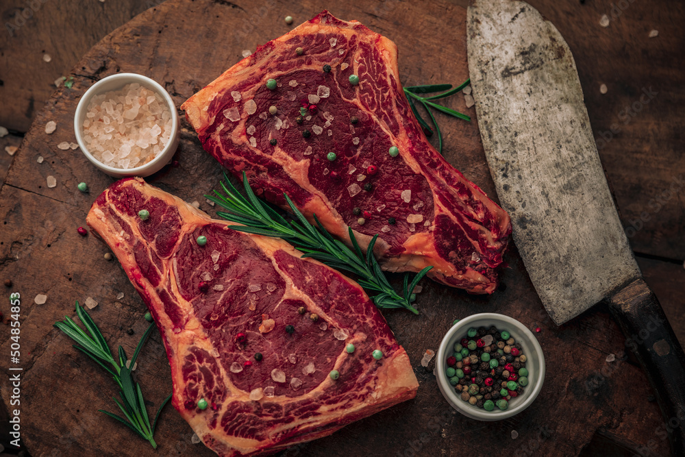 aesthetic picture of red beef steak with sprinkles of salt and pepper ...