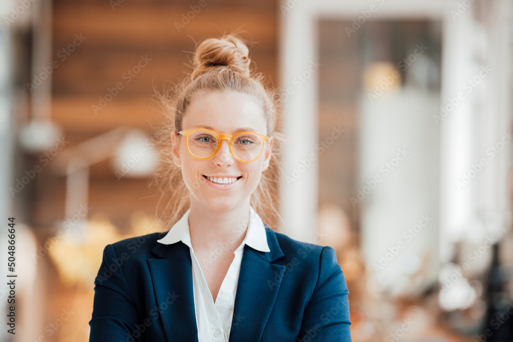Businesswoman wearing eyeglasses at office Stock Photo | Adobe Stock