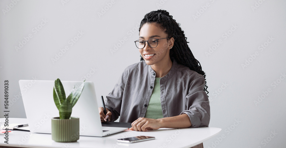 Young woman using laptop computer at office panoramic banner, Student ...