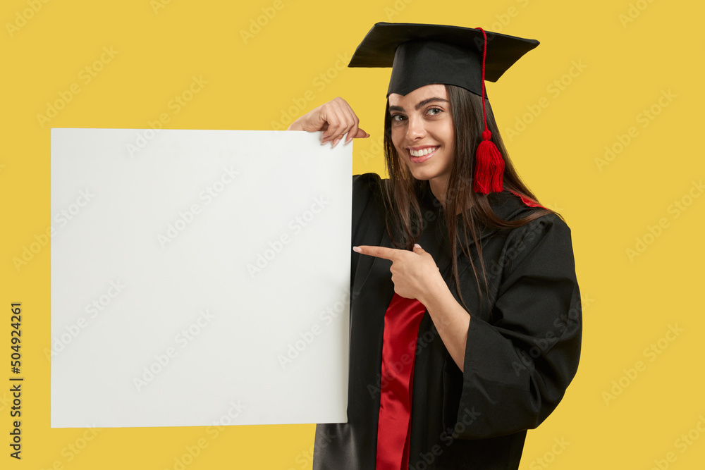Front view of brunette girl graduating from college, university. Pretty ...