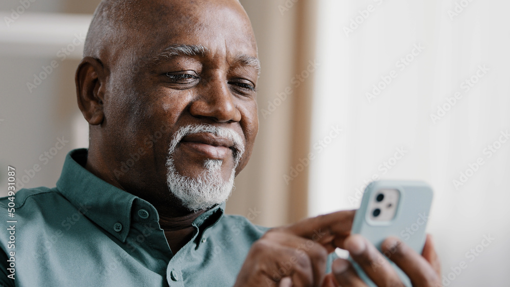 Mature elderly old African 60s biracial man using phone American ...