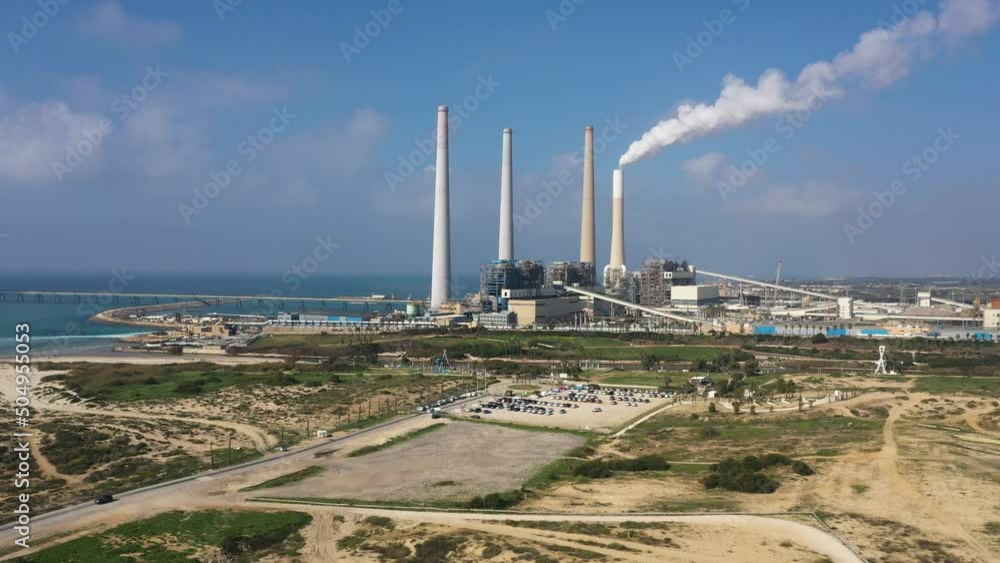 Hadera Park, Orot Rabin Power plant aerial tracking shot with blue sky ...