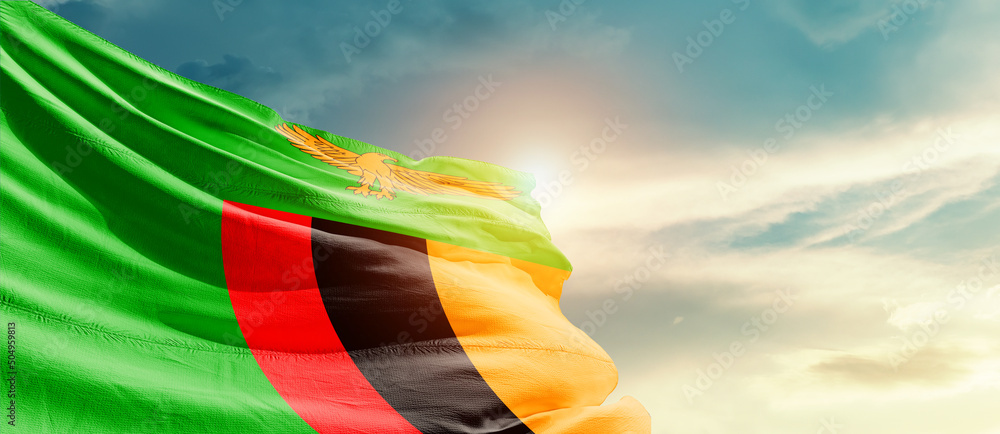 Zambia national flag cloth fabric waving on the sky - Image Stock Photo ...