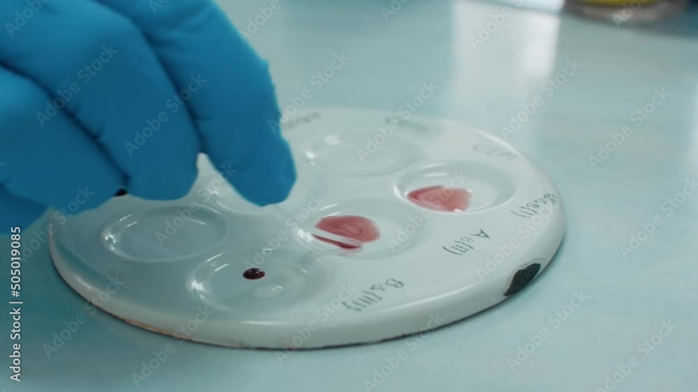 Medical development laboratory: female scientist is looking in the ...