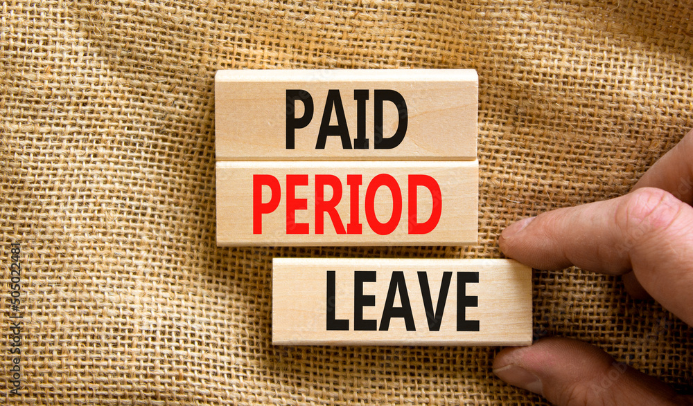 Paid period leave symbol. Concept words Paid period leave on wooden ...