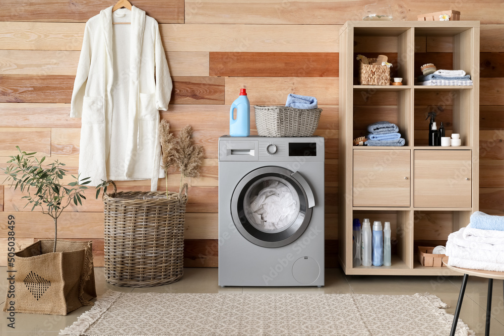 Interior of home laundry room with modern washing machine Stock Photo ...