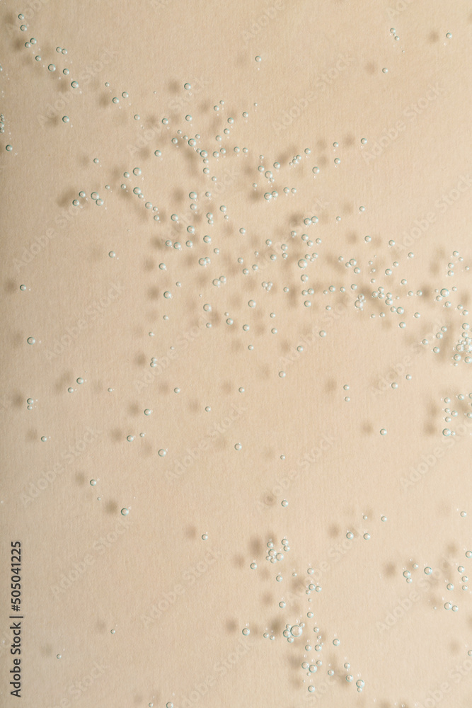 Water with bubbles on beige background Stock Photo | Adobe Stock