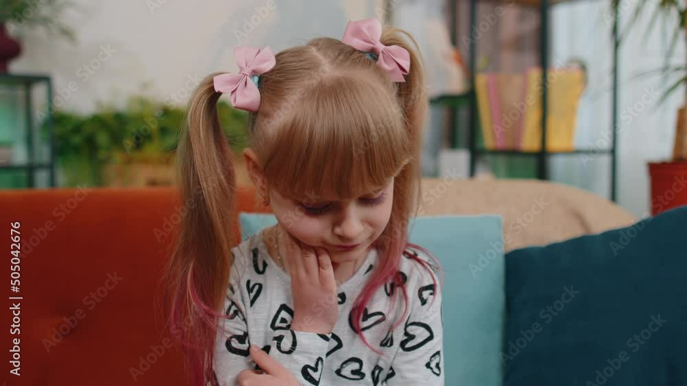 Dental problems. Caucasian little toddler kid girl touching cheek ...