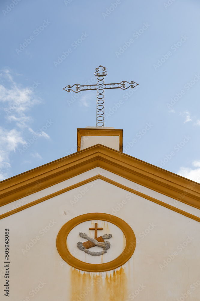Metal cross on the roof and christian symbol crossed arms and a cross ...