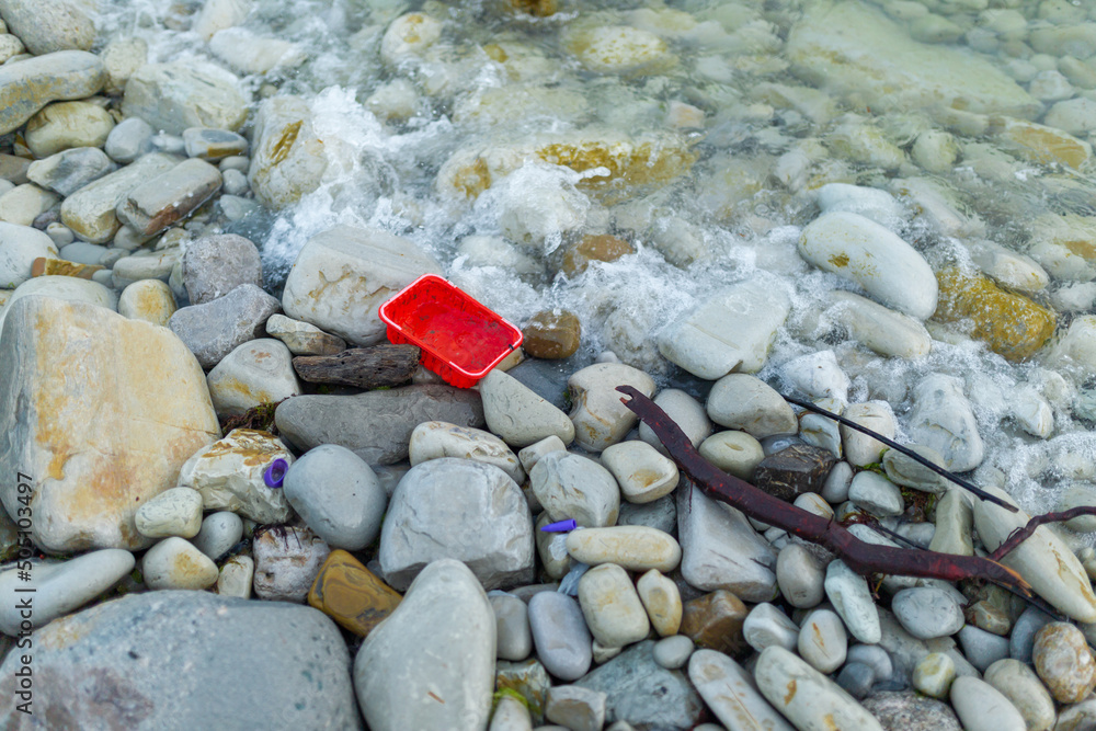 Plastic garbage on a beach coming from the sea. Pollution in the oceans ...
