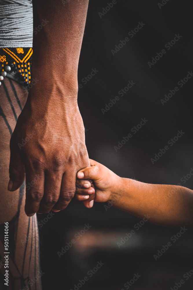 Indian father and son holding hands Stock Photo | Adobe Stock