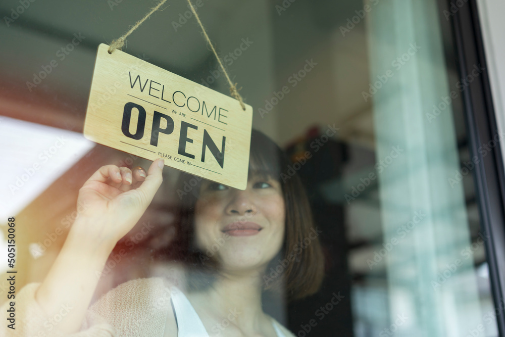 Asian young asian woman setting open sign at the shop glasses for ...