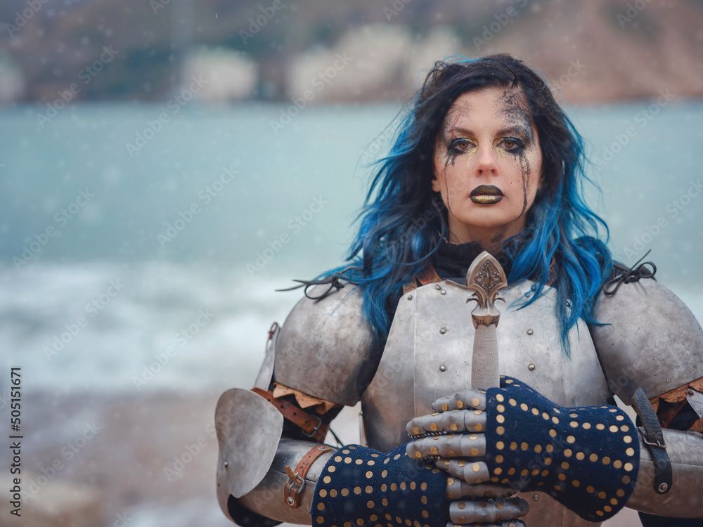 Medieval knight woman in armor prays, blessing before the battle. Stock ...