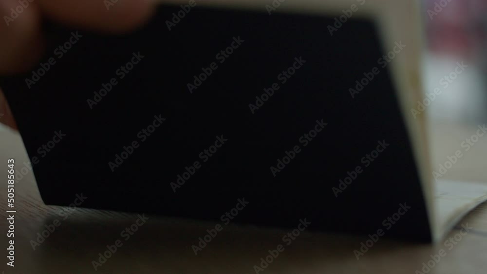 One employee takes a passport in hand and puts a entry stamp. To give ...