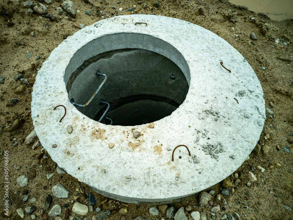 Dug-in concrete well rings with a concrete cover. Plumbing and sewerage ...