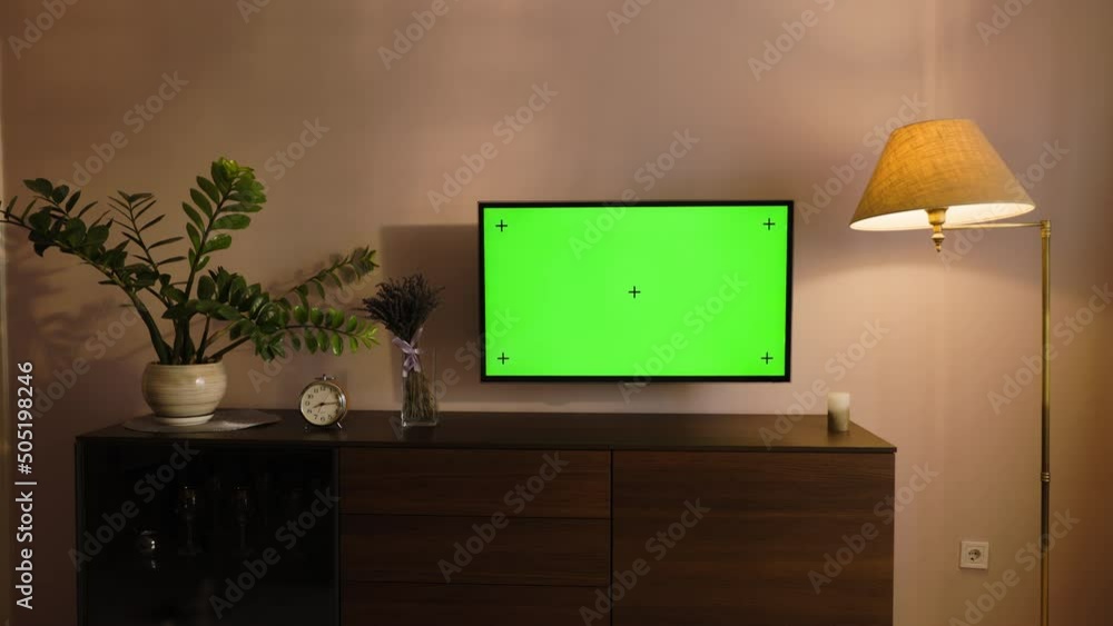 Stylish apartment interior with TV Set with green screen mock up ...