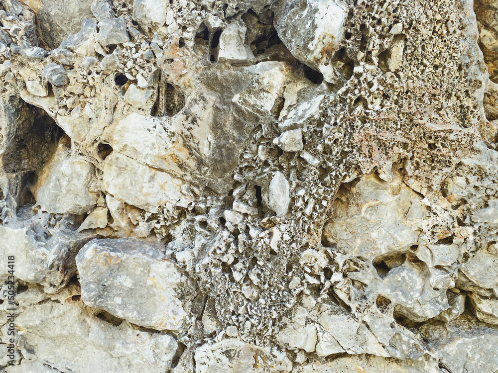 rock formation on the sea. a stone made of sand, a large boulder lies ...