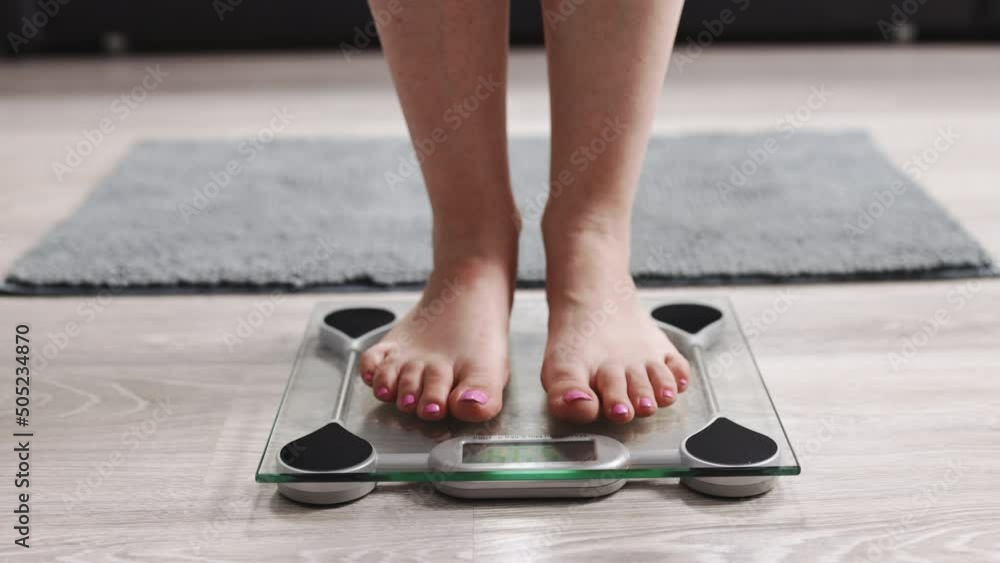 Female On Scales Measure Weight. Fit Girl Legs Step Bathroom Scale ...