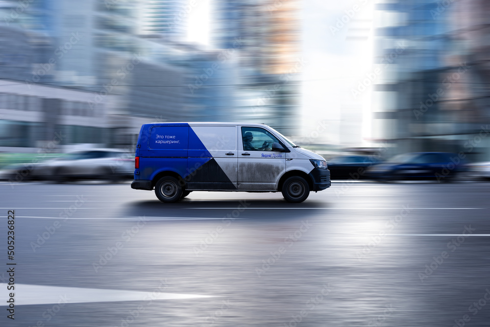car of the Yandex drive car sharing company driving on high speed ...