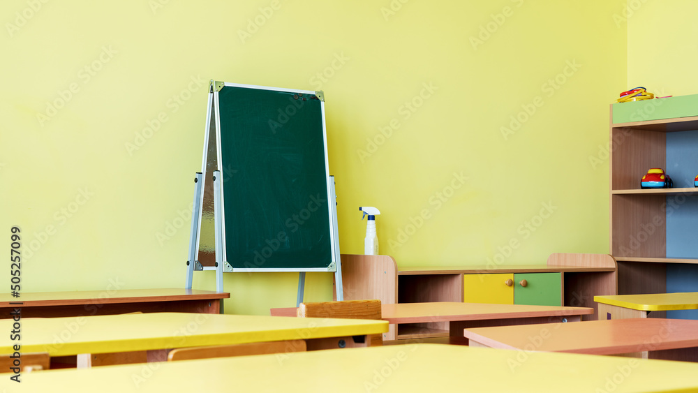 Empty classroom of children education center with vertically blank ...