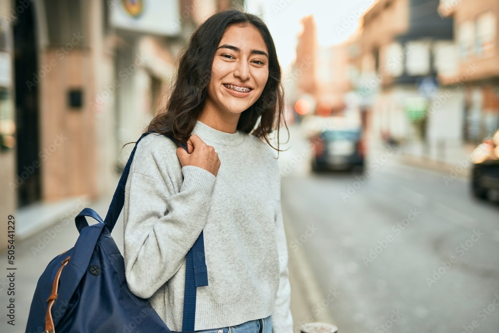 Young middle east student girl smiling happy standing at the city ...