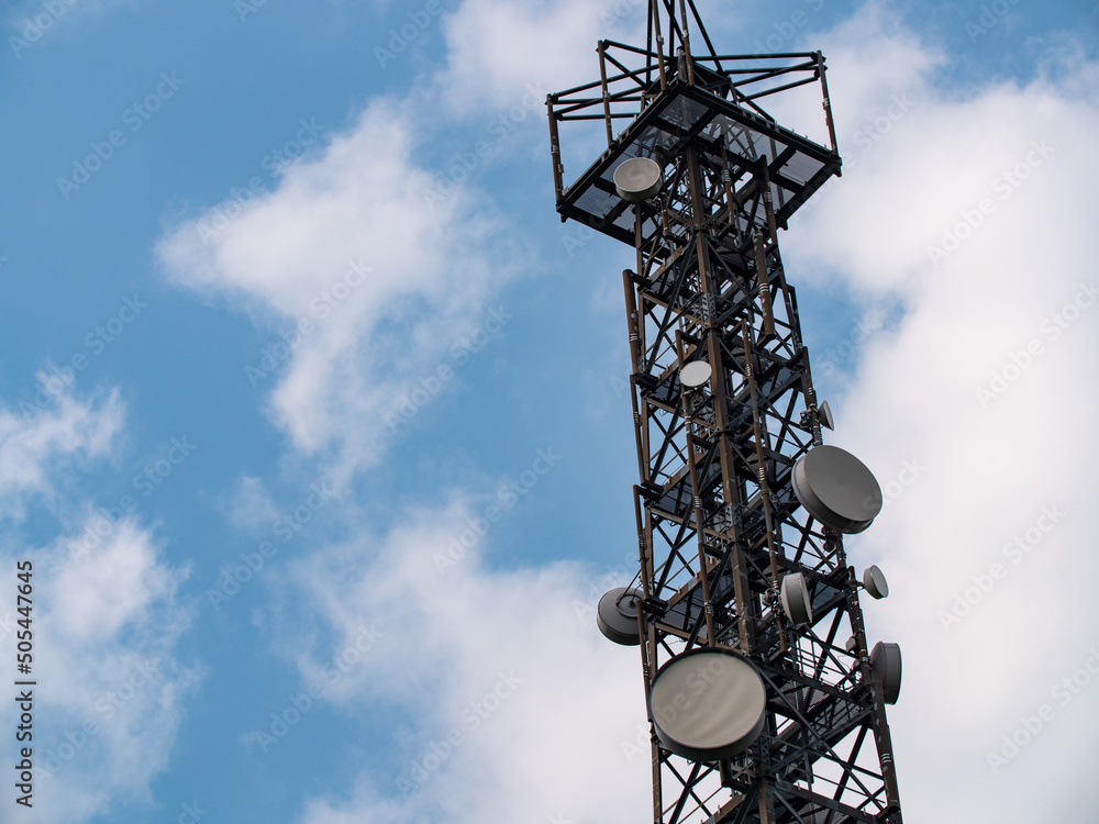 Radio tower with blue sky and some clouds. Radio tower for ...