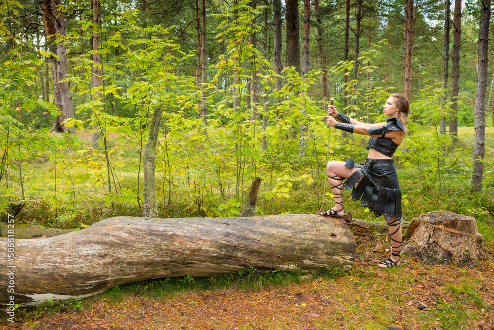 medieval knight of the road girl wearing leather lorica, bracer ...
