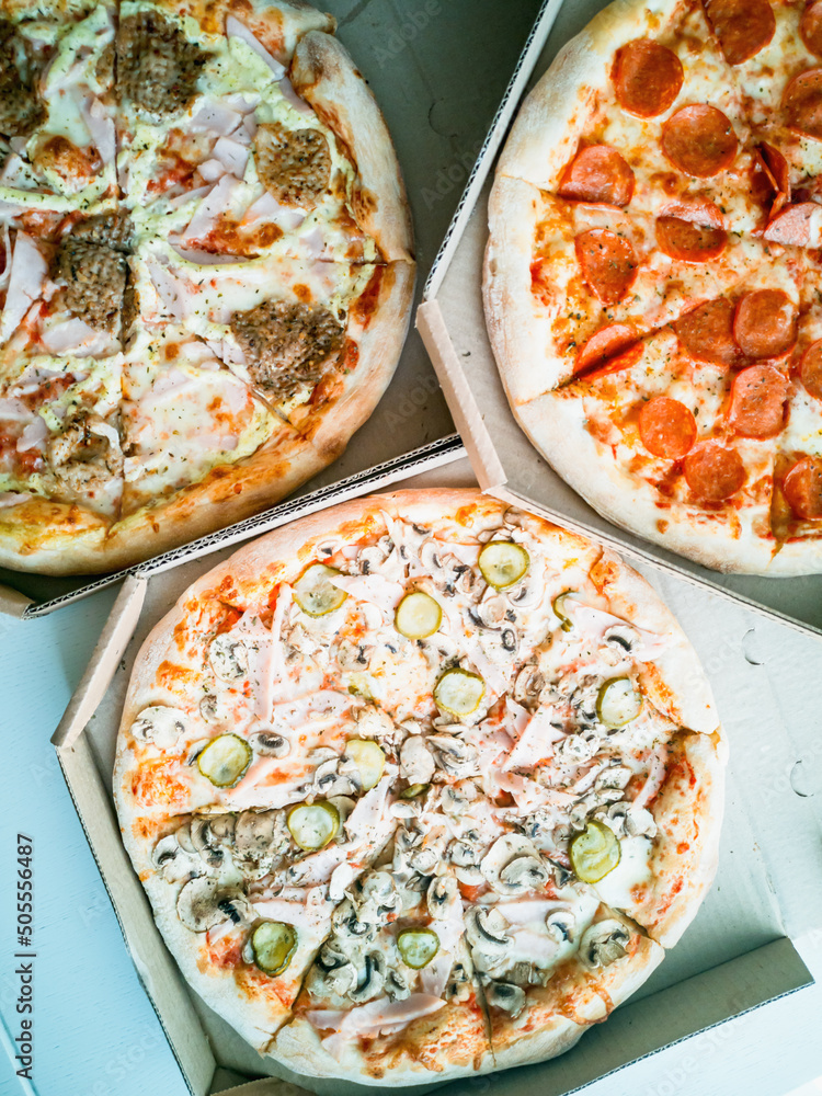 Online food ordering and food delivery. Pizza in boxes. Stock Photo ...