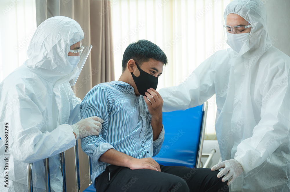 Covid-19 doctors helping male patient with coronavirus infection ...