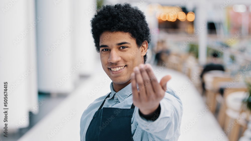 Friendly african american young guy male waiter salesman restaurant ...