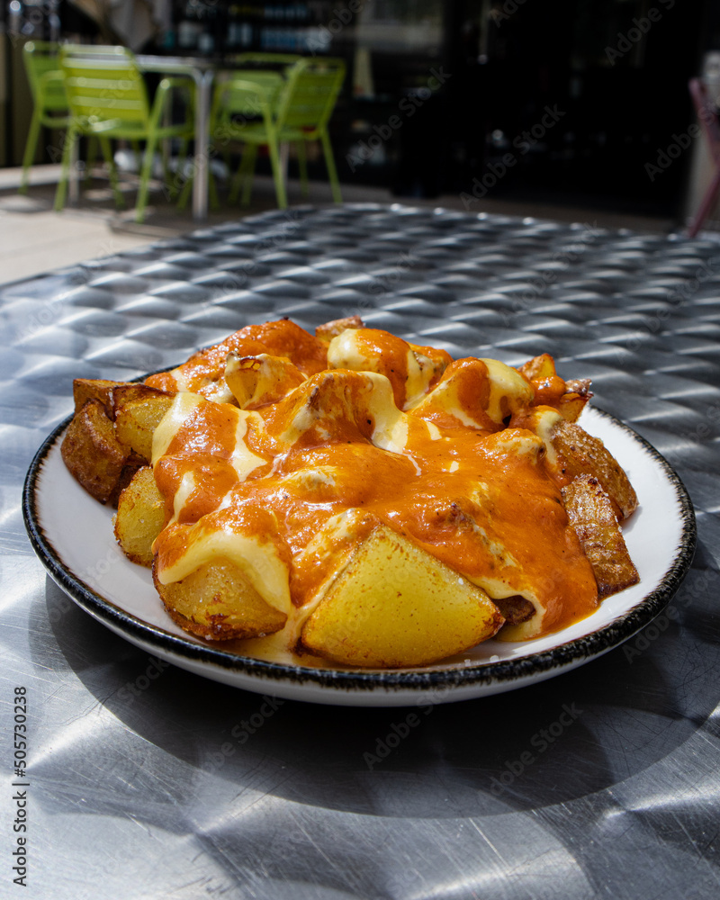 Ración de patatas al estilo brava con salsa poco picante (ration of ...