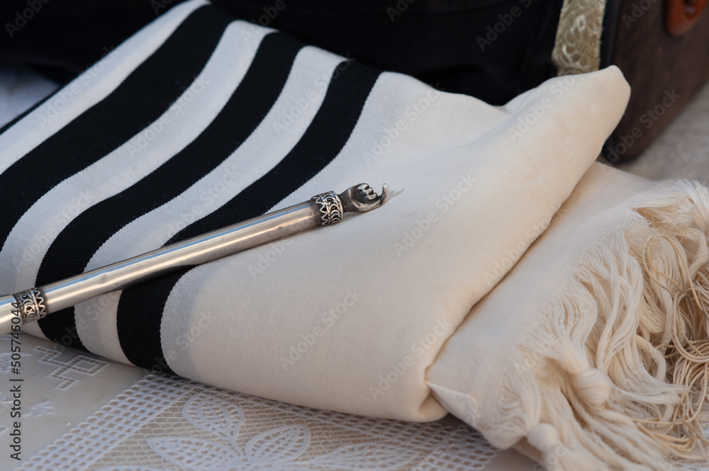 A silver pointer or yad used to guide the person reading from the Torah ...