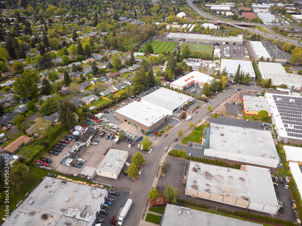Shooting from a drone. A small city, a lot of greenery, paved walkways ...