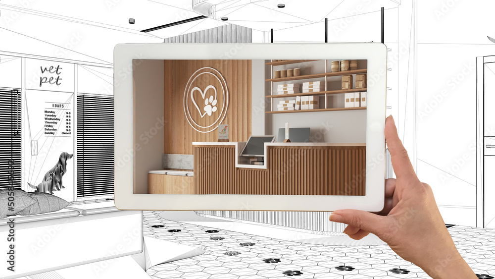 Augmented reality concept. Hand holding tablet with AR application used ...