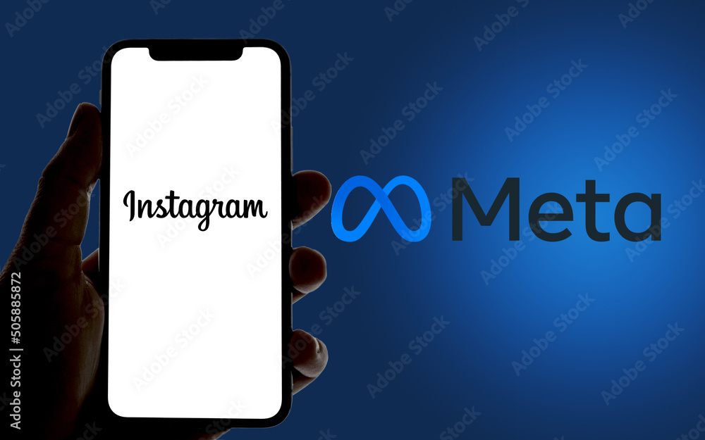 instagram logo is displayed on a smartphone, with the logo of the meta ...