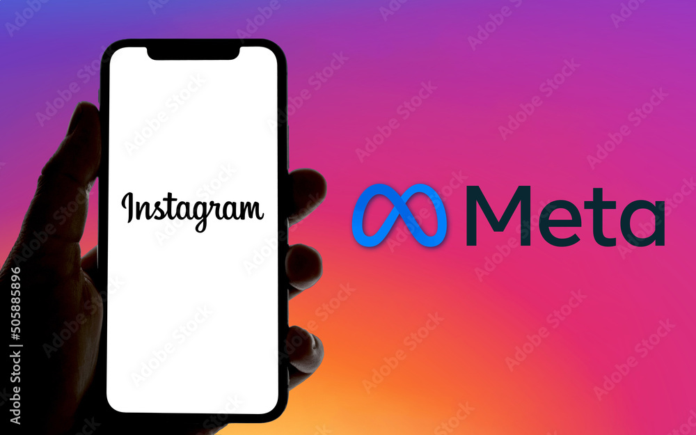 instagram logo is displayed on a smartphone, with the logo of the meta ...