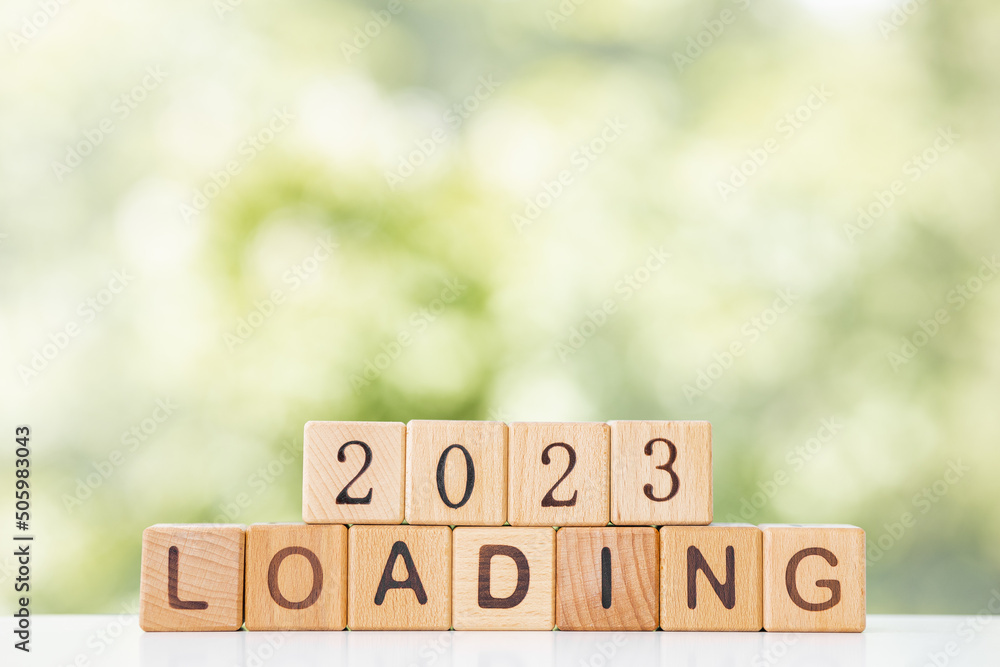 2023 New Year Loading. Loading new year 2023 with wood cube in progress ...