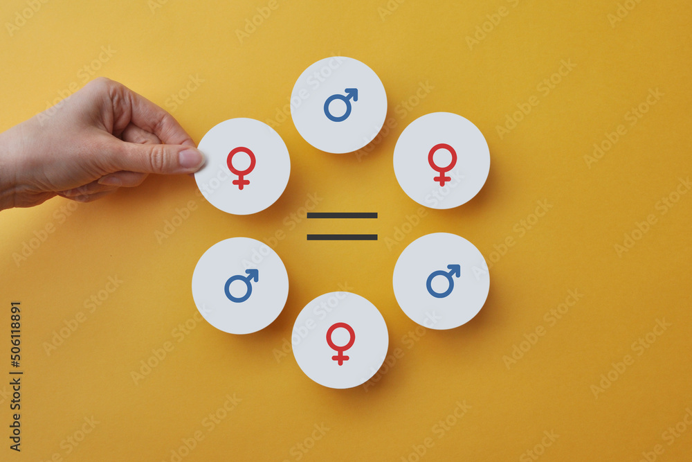 Paper mugs with badges of men and women Equality between men and women ...