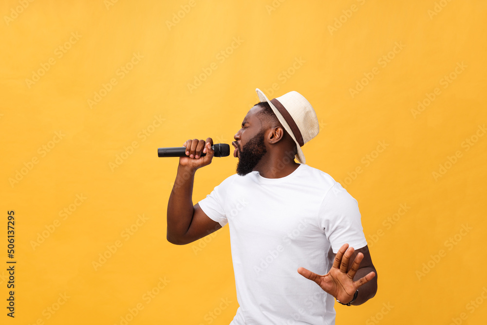 Young teenage black African American boy singer performing at a concert ...