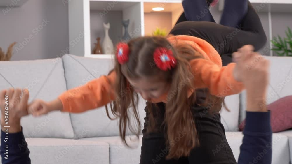 Father playing with his little daughter. The father is playing on the ...