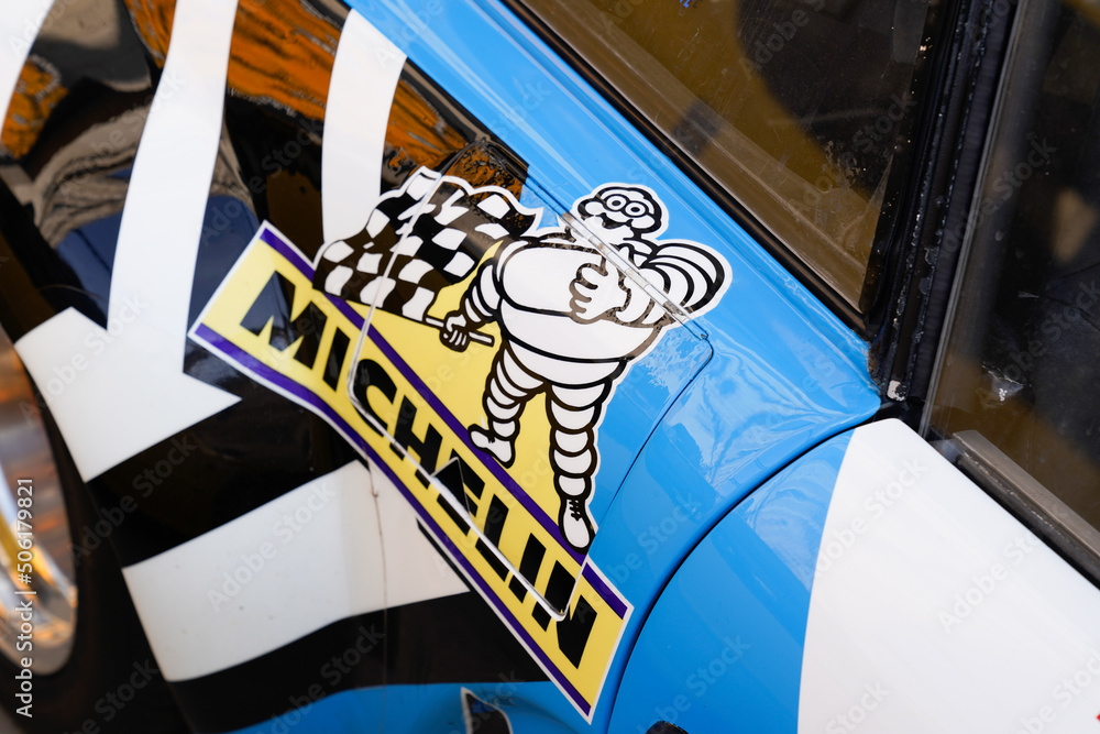 Michelin text brand and logo sign on alpine renault rally side car of ...