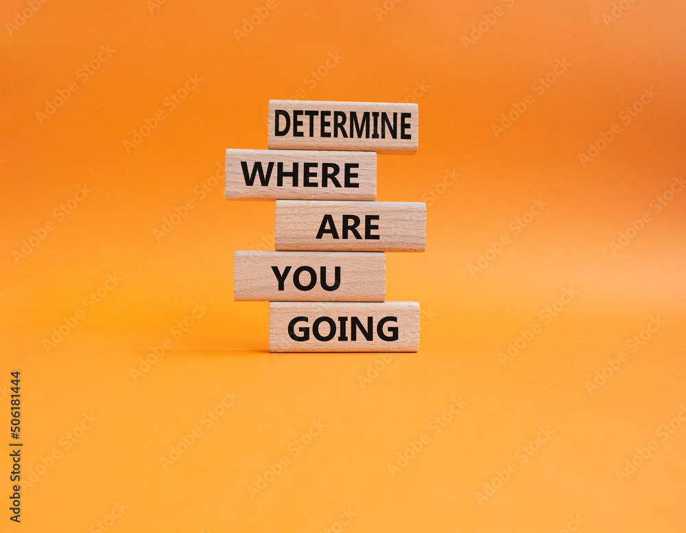 Determination symbol. Wooden blocks with words Determine where you are ...