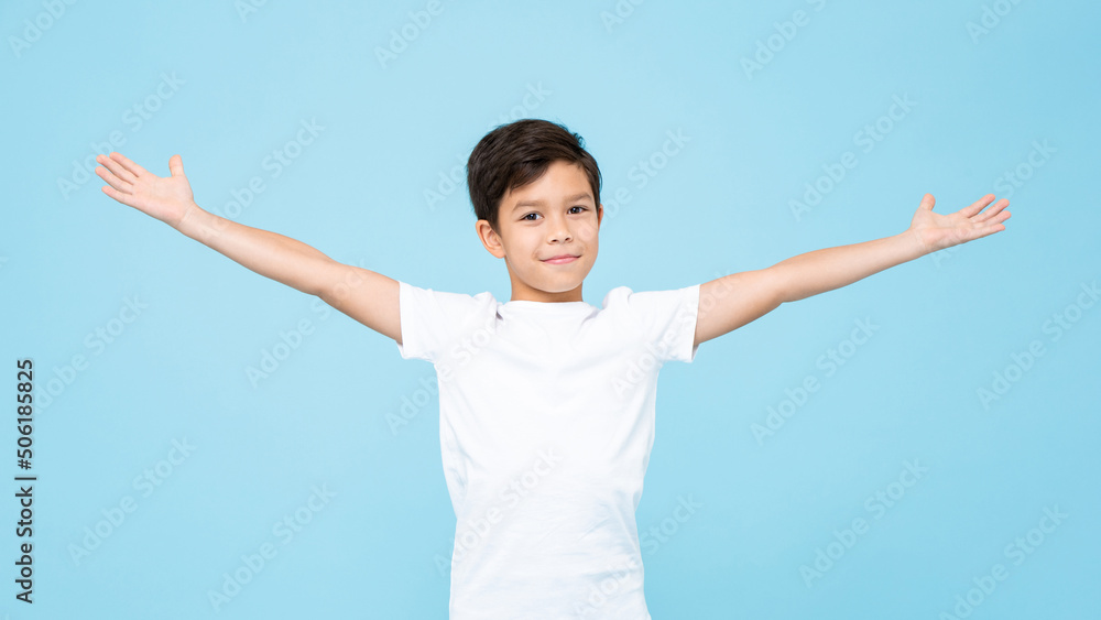 Cute smiling handsome mixed race boy with open arms in isolated light ...