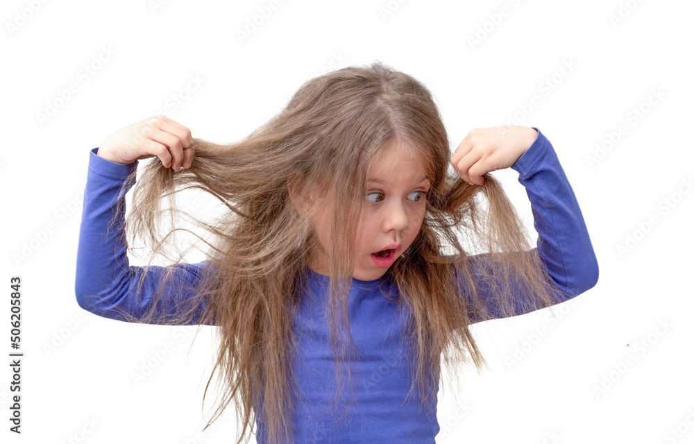 Isolated caucasian little girl of 5 6 years holding hair being in shock ...