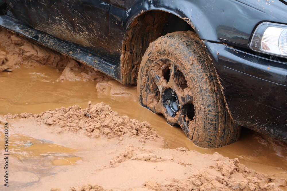 Dark blue car stuck in mud after floods caused by storm Stock Photo ...